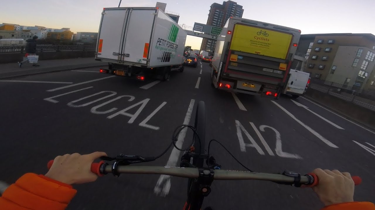 Full speed GoPro POV wheelies in city traffic