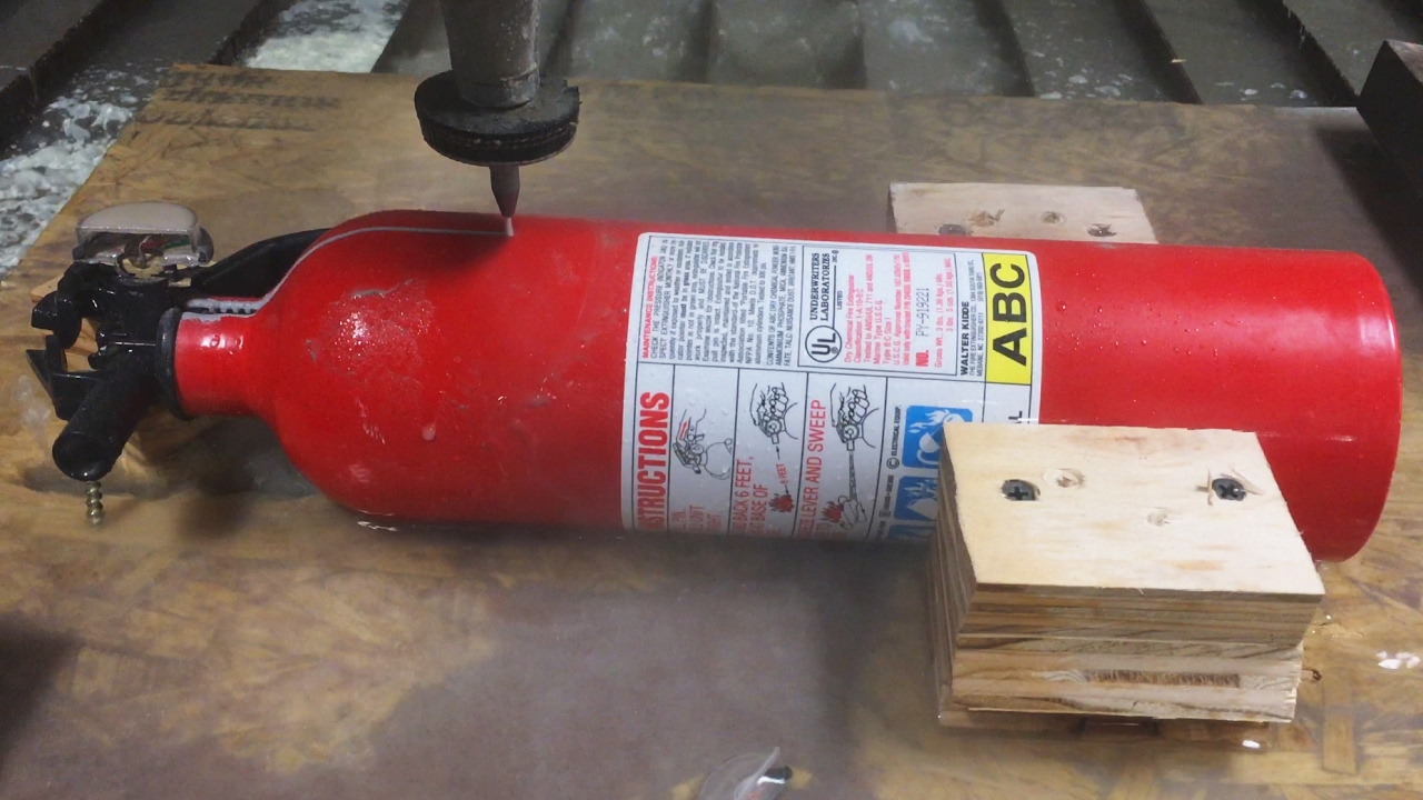 Fire extinguisher cut in half with a 60,000 PSI waterjet cutter ...