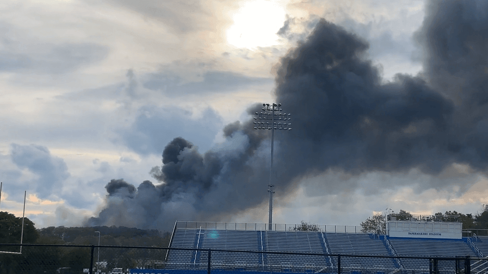Large mulch fire extends into York County woods, sending smoke into air
