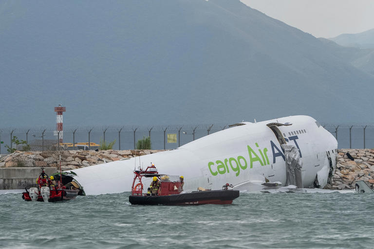 Two dead as Hong Kong cargo plane splits in half after skidding off ...