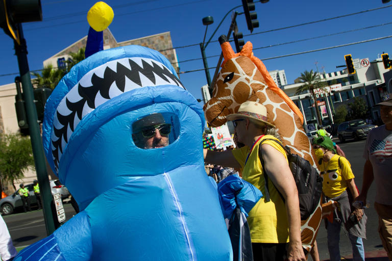 Why protesters against Trump are wearing frog, chicken and T. rex costumes
