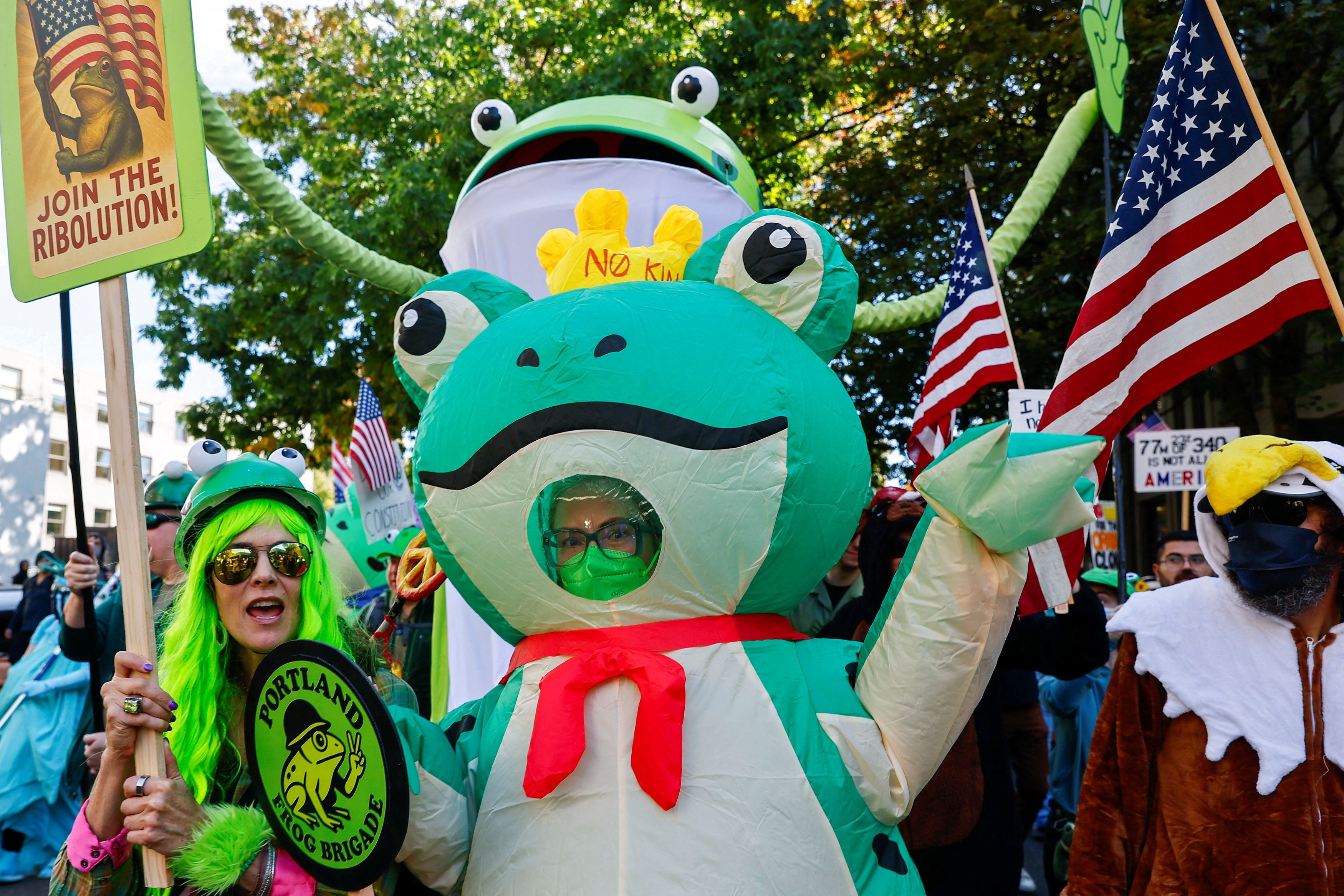 Why protesters against Trump are wearing frog, chicken and T. rex costumes