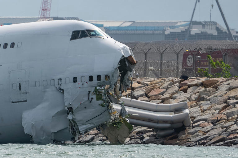 Two dead as Hong Kong cargo plane splits in half after skidding off ...