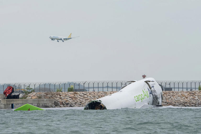 Two dead as Hong Kong cargo plane splits in half after skidding off ...