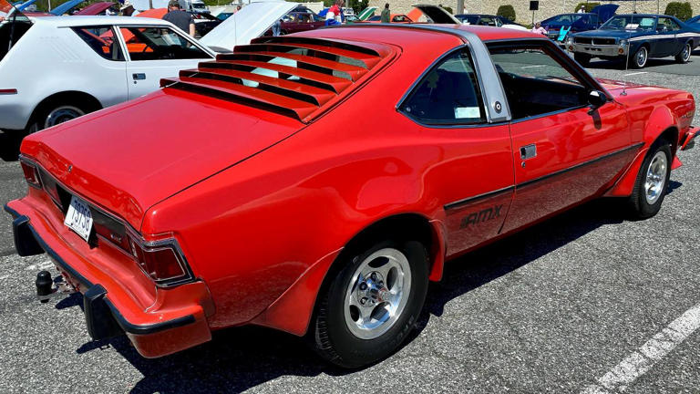 Why did muscle cars come with rear window slats?