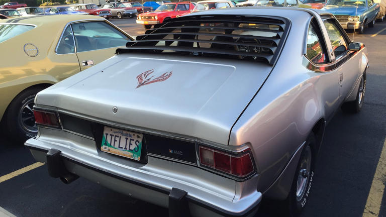 Why did muscle cars come with rear window slats?
