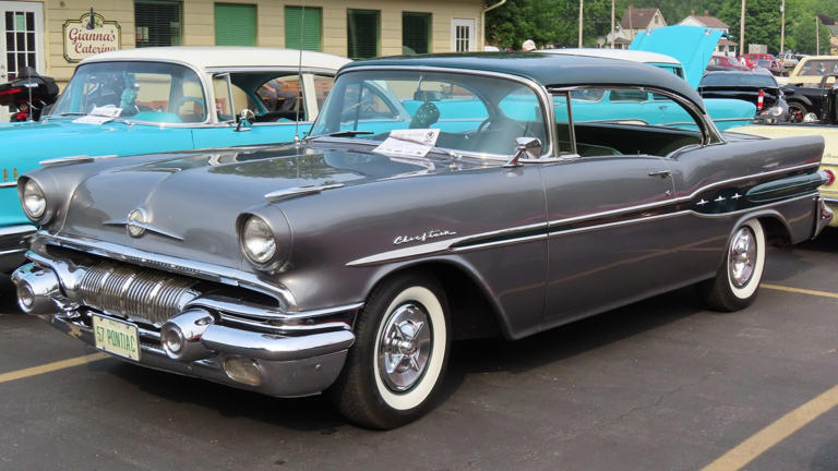 Why did old cars use hidden fuel filler doors?