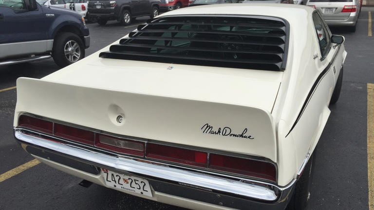 Why did muscle cars come with rear window slats?