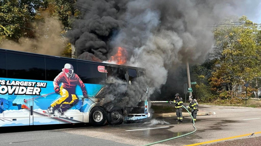 Bus carrying UMass Lowell students catches fire in Westwood, Massachusetts