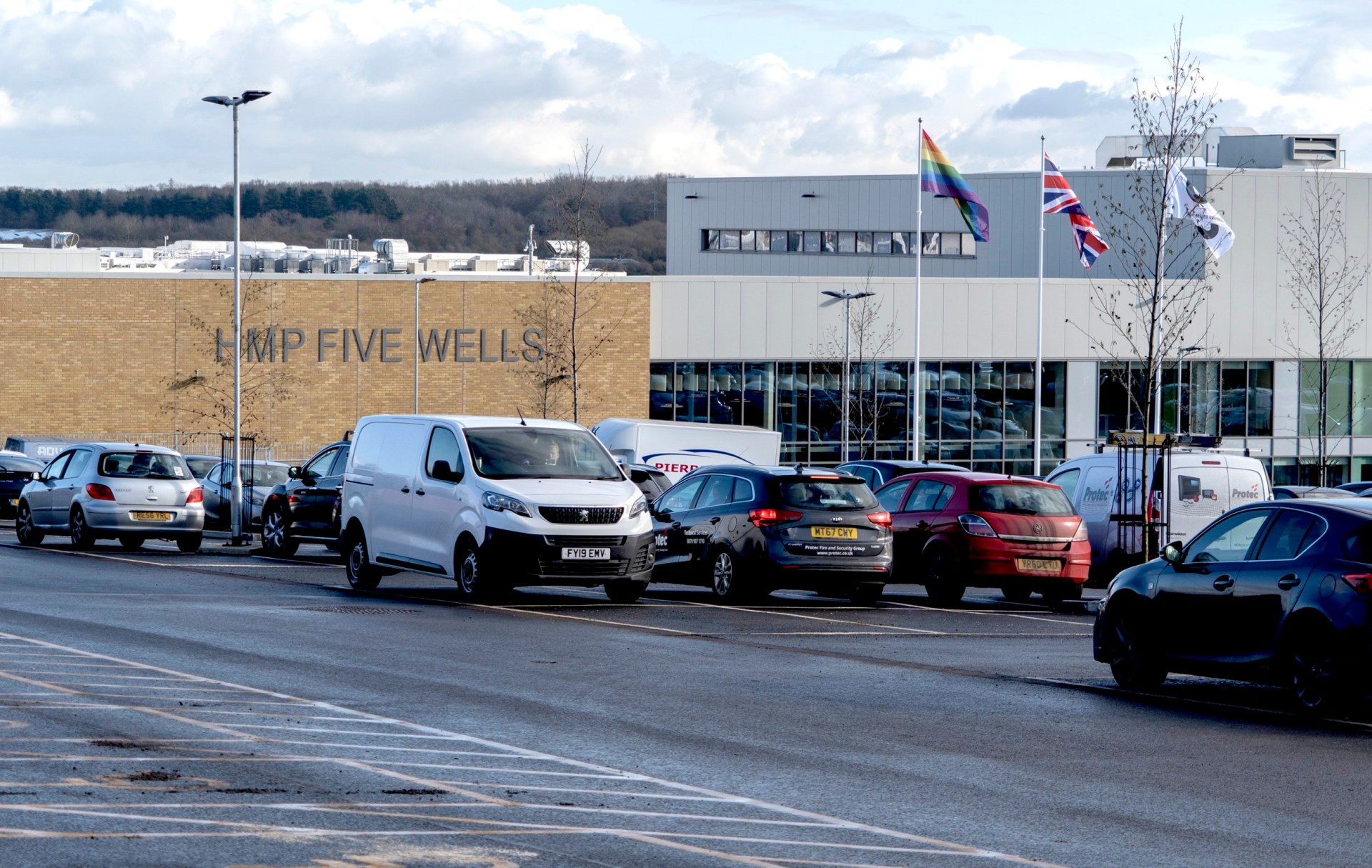 Prison officer and inmate in court over 'affair'