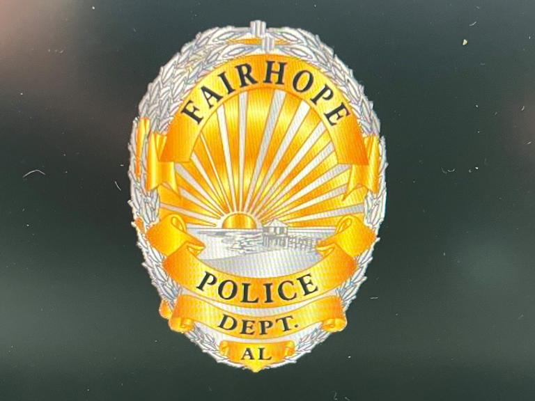 Woman in phallic costume arrested during protest in Fairhope, police say