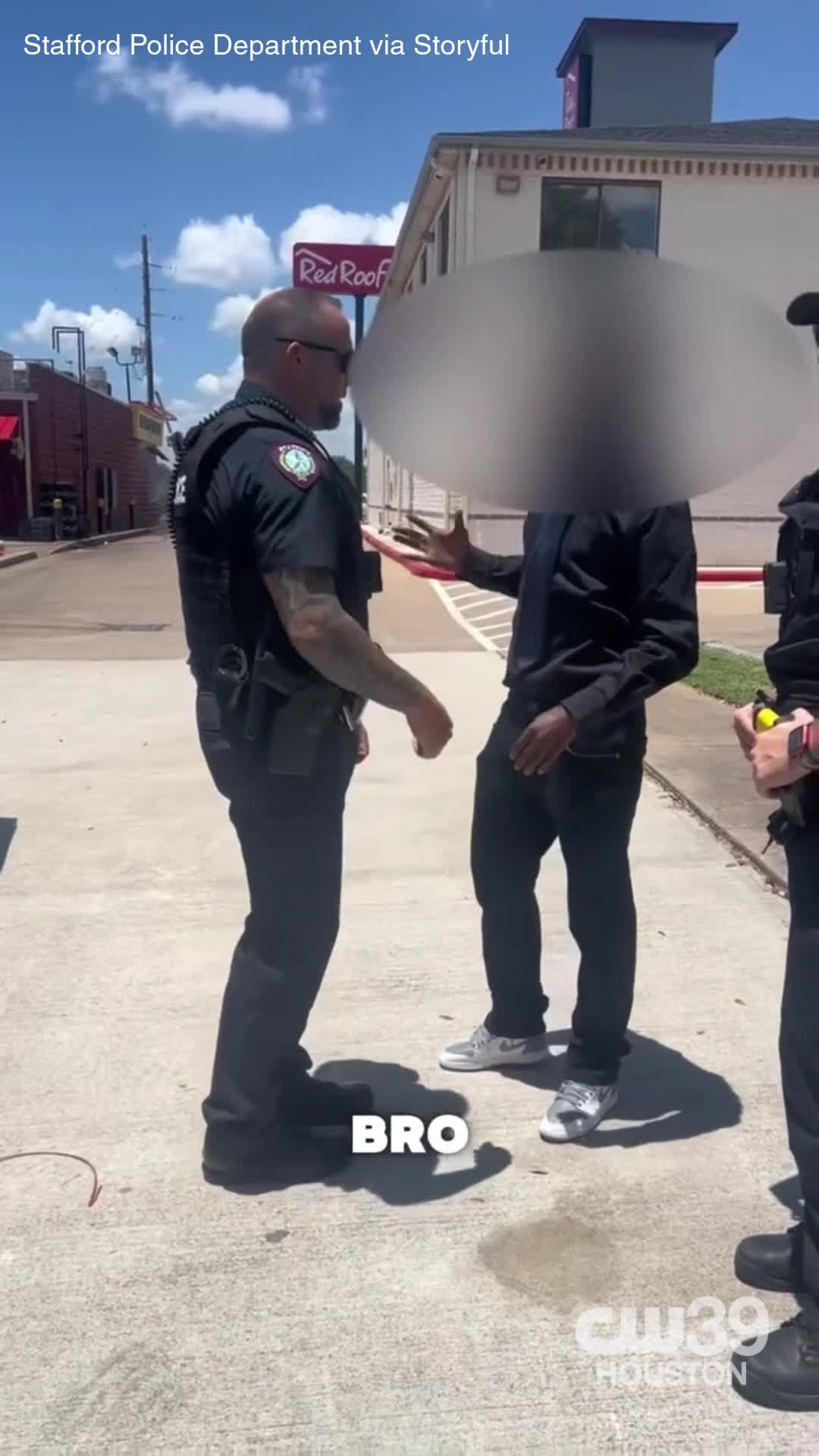 Stafford police officer helps young man with his tie before job interview