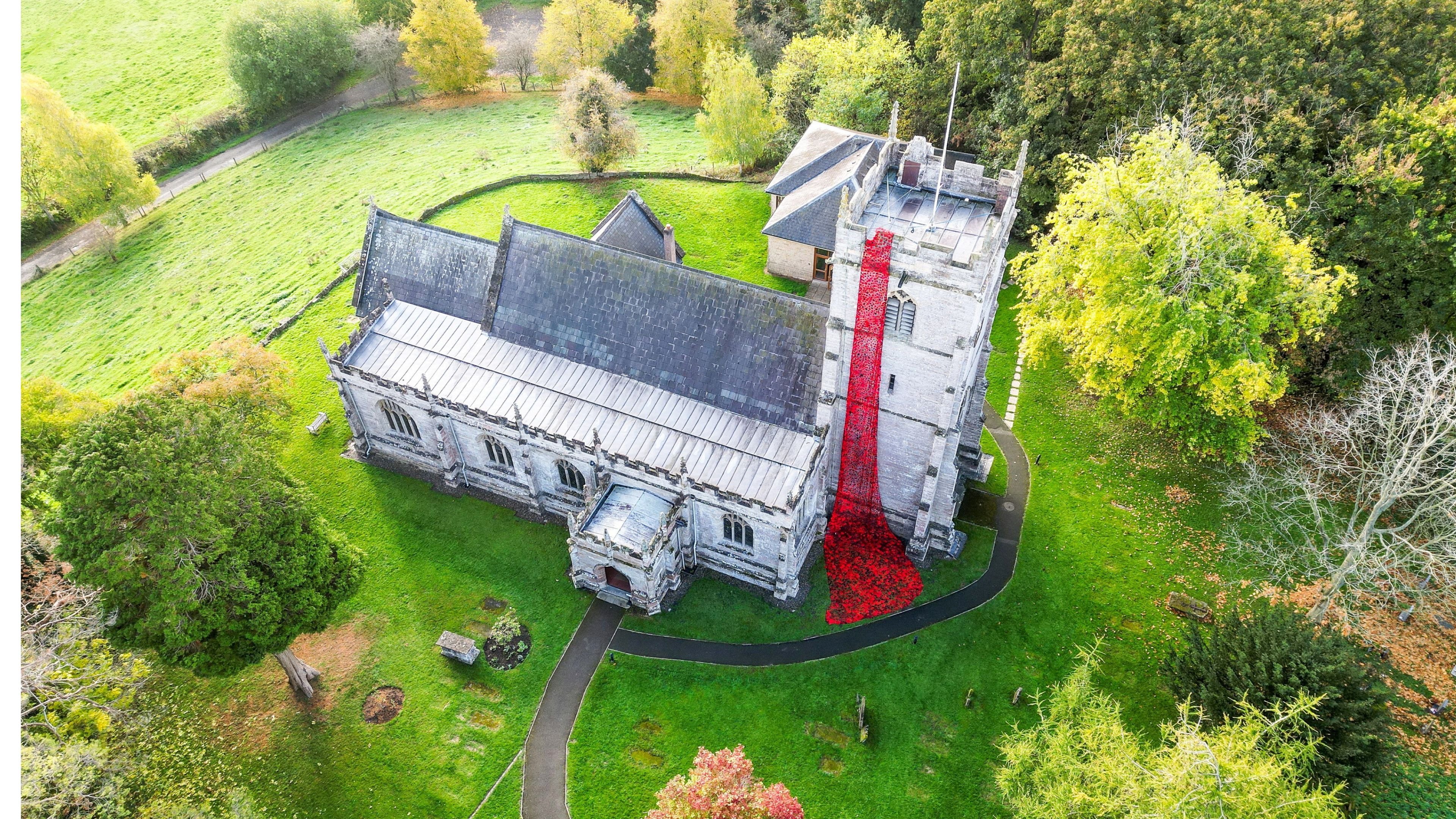 Thousands of crocheted poppies cascade from church ahead of Remembrance Day