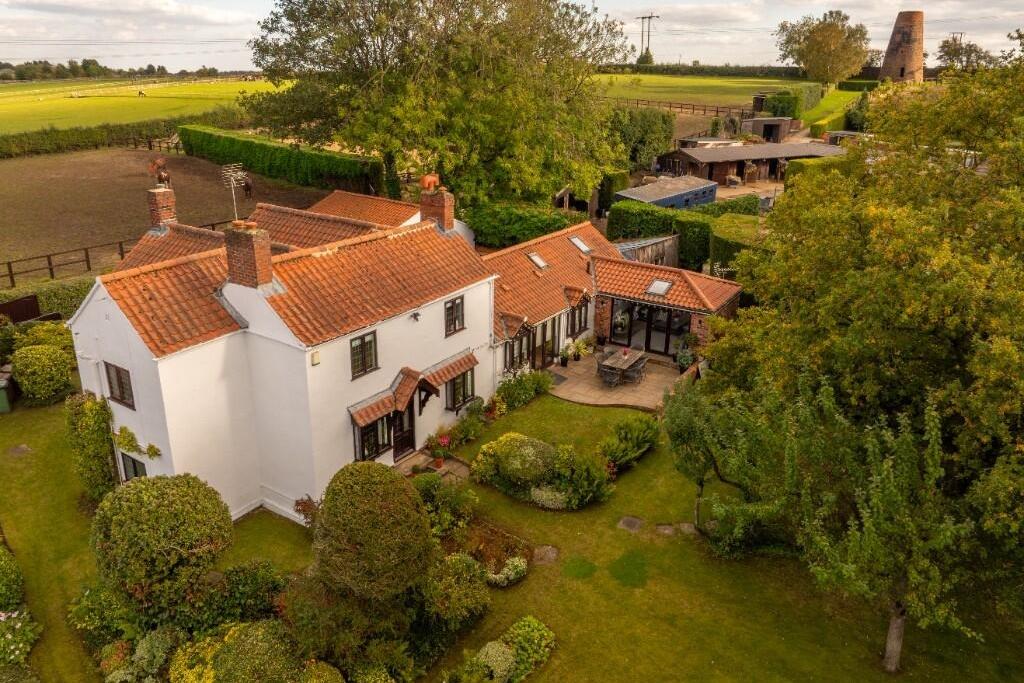 Inside this very comfortable, updated cottage with an interesting ...