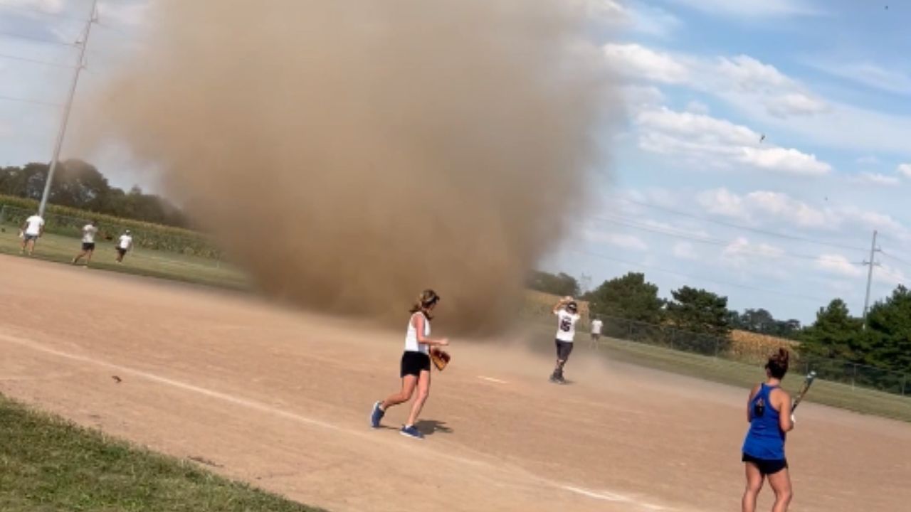 Sudden dust storm brings competitive softball game to a momentary halt