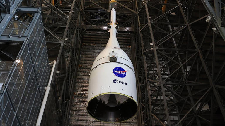 NASA stacks Artemis 2 moon mission's Orion capsule atop SLS rocket ...