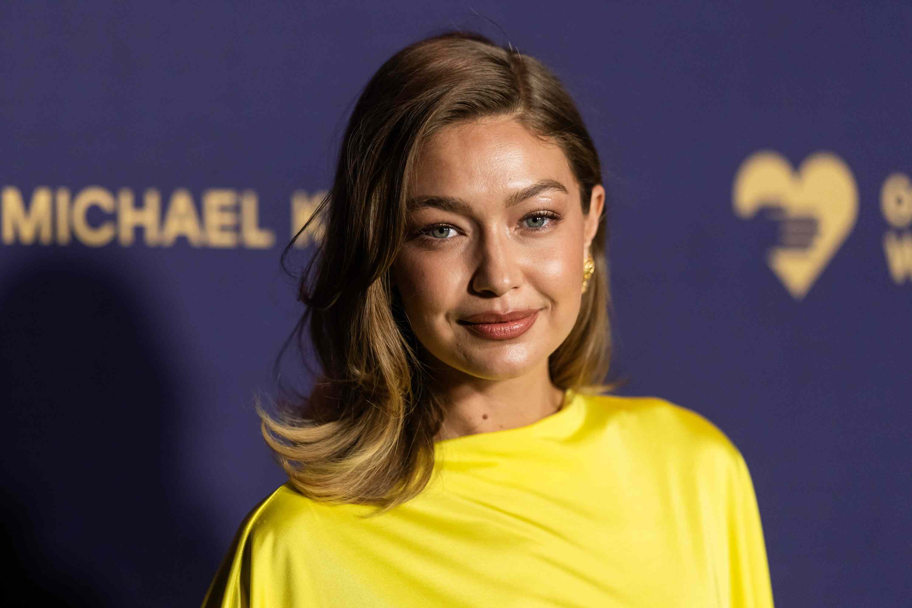 Gigi Hadid Pairs a Divisive, Asymmetrical Dress With Optical Illusion Shoes