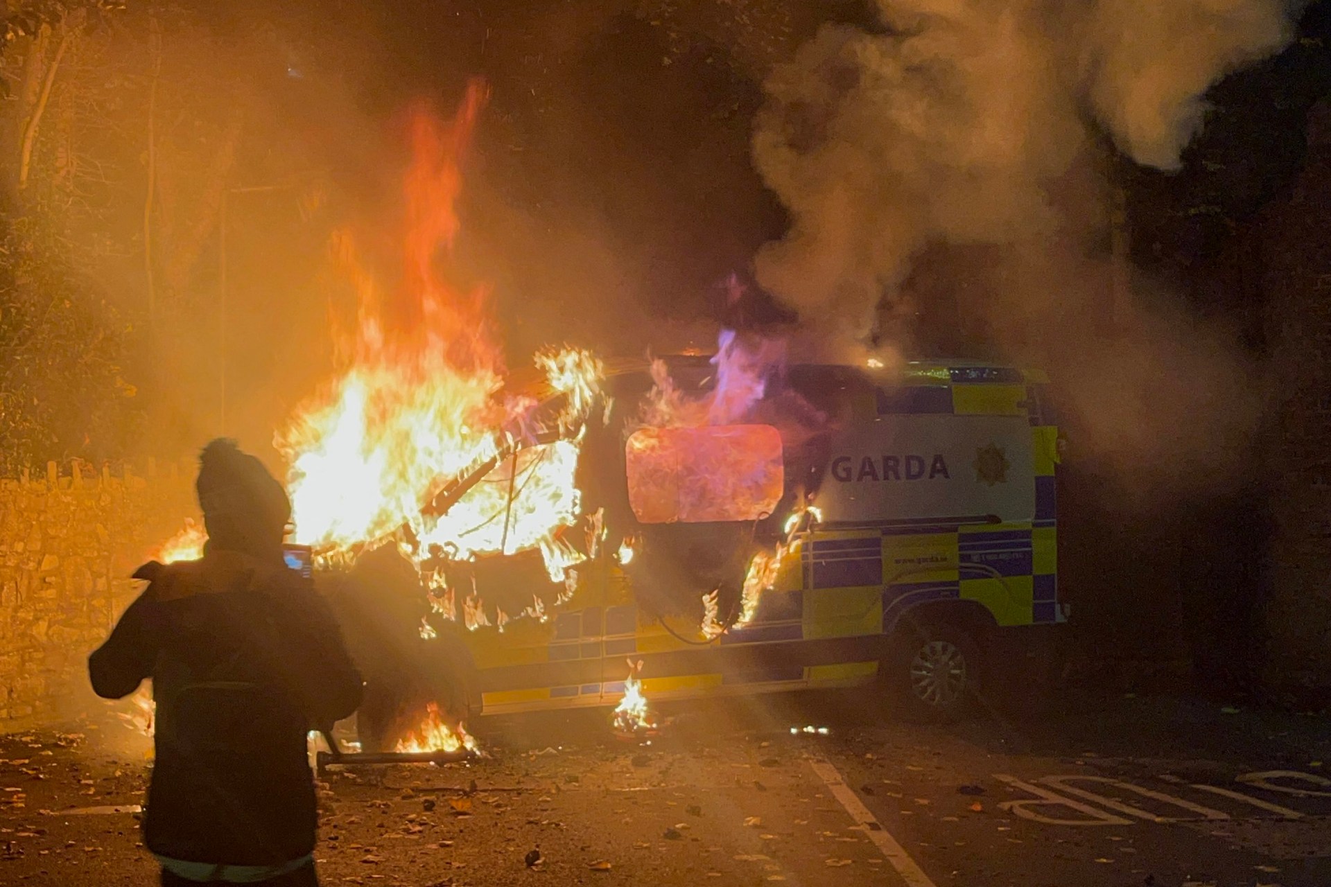 Police van set alight at Citywest protest in Dublin