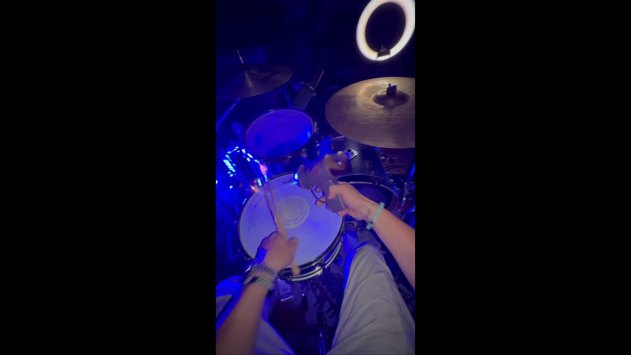 Drummer lights up the night with fire-powered performance