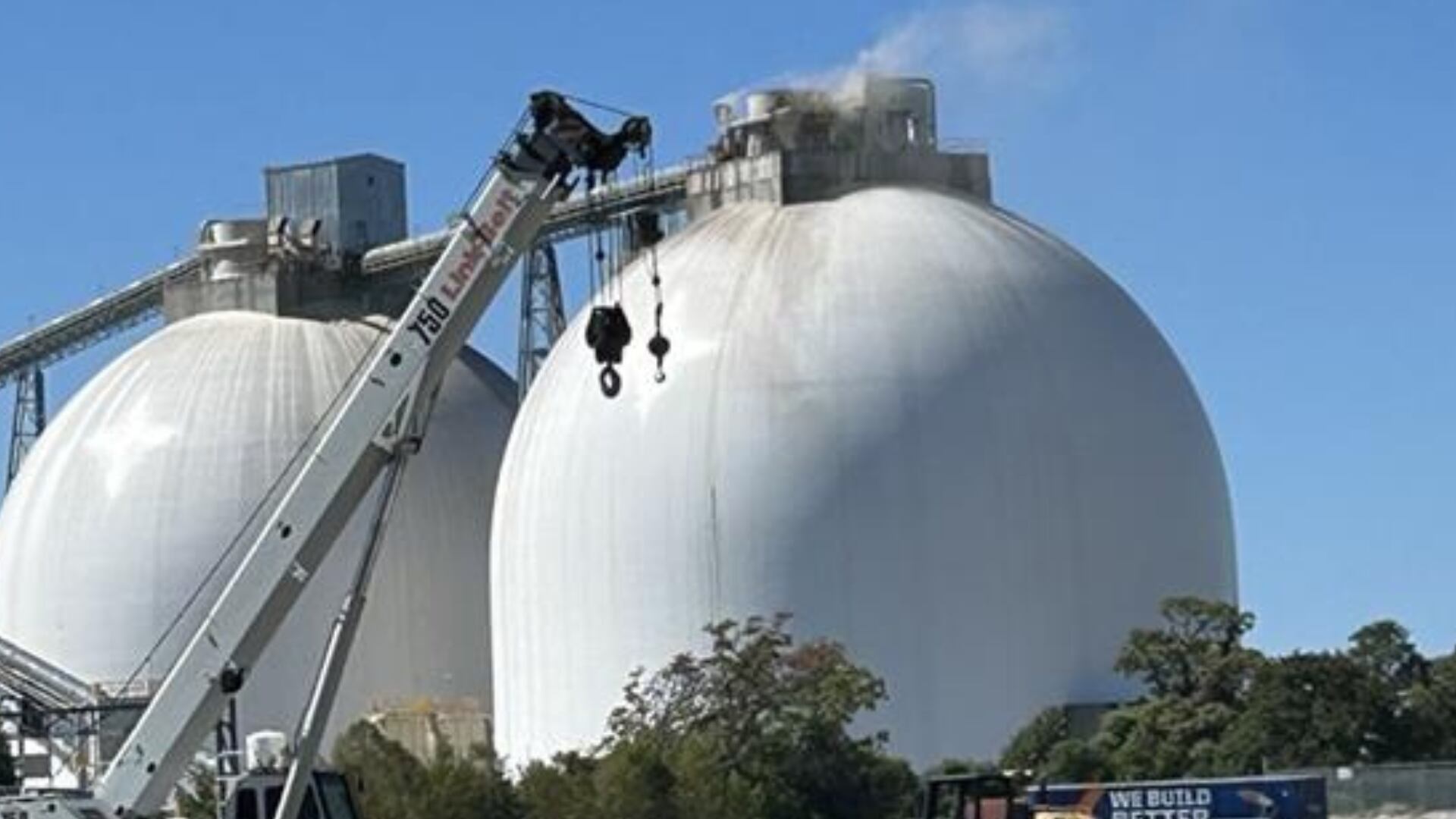 Crews working to extinguish fire inside wood pellet dome at Port of ...