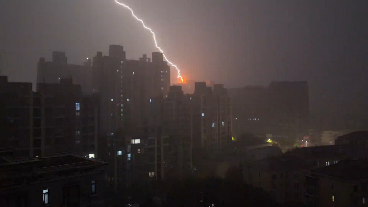 Lightning strikes building during thunderstorm in Shanghai, China