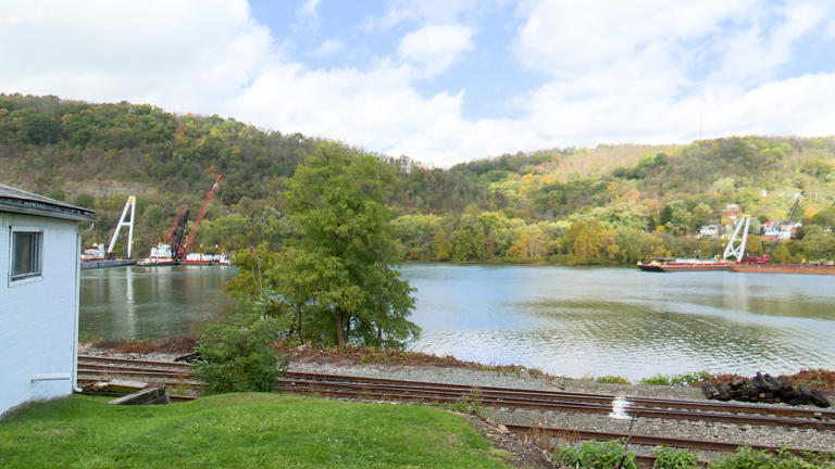 Cleanup of overturned dredge boat continues on Ohio River in West Virginia