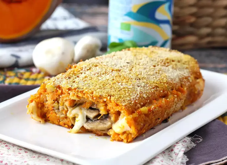 Vegetarian pumpkin "meatloaf" with mushrooms and stringy scamorza cheese
