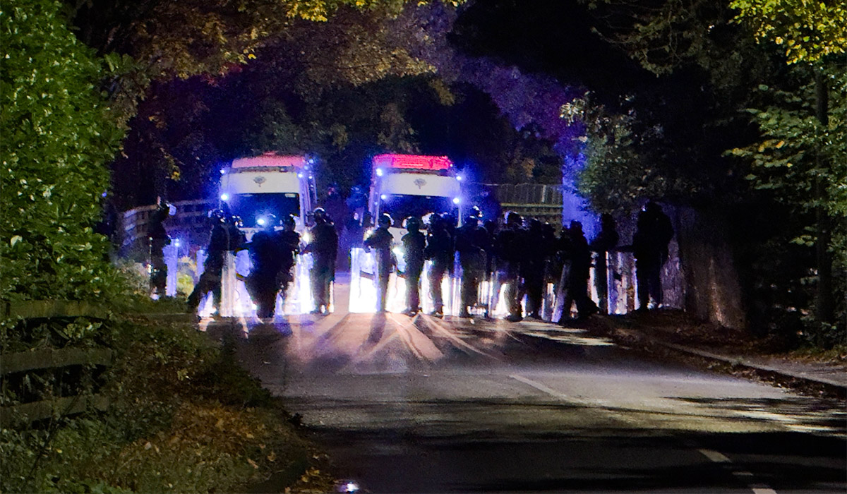Justice Minister condemns protest as Garda van set on fire at Citywest