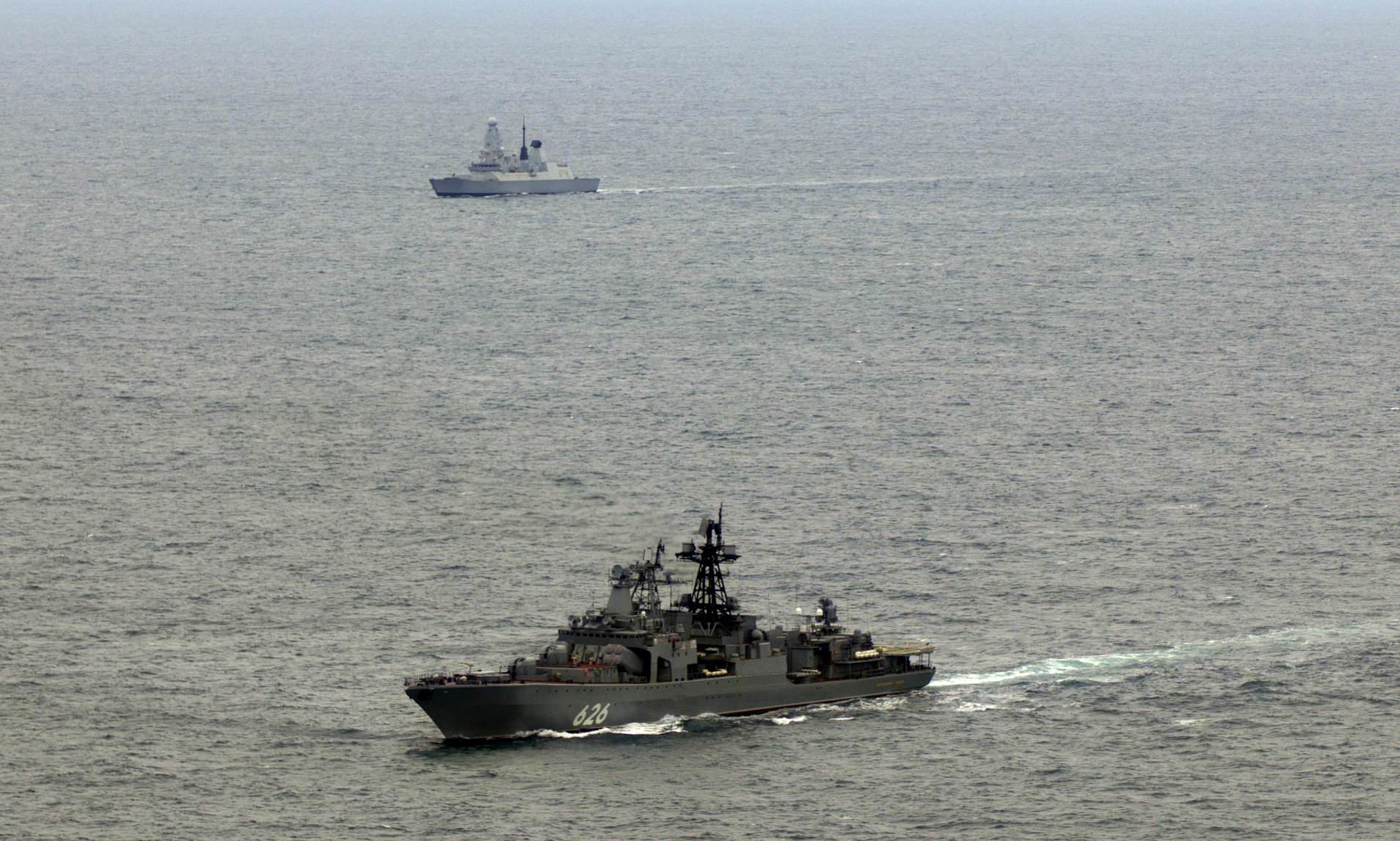 Royal Navy warship and helicopter team up to track Putin destroyer ...