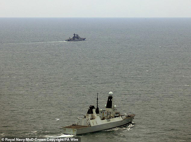Royal Navy warship and helicopter team up to track Putin destroyer ...