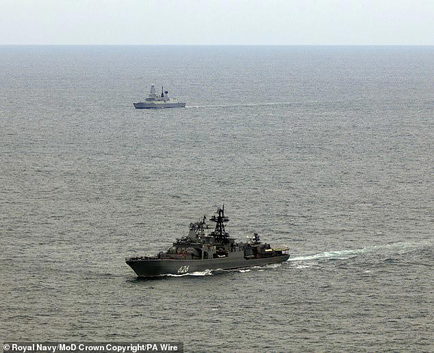 Royal Navy warship and helicopter team up to track Putin destroyer ...