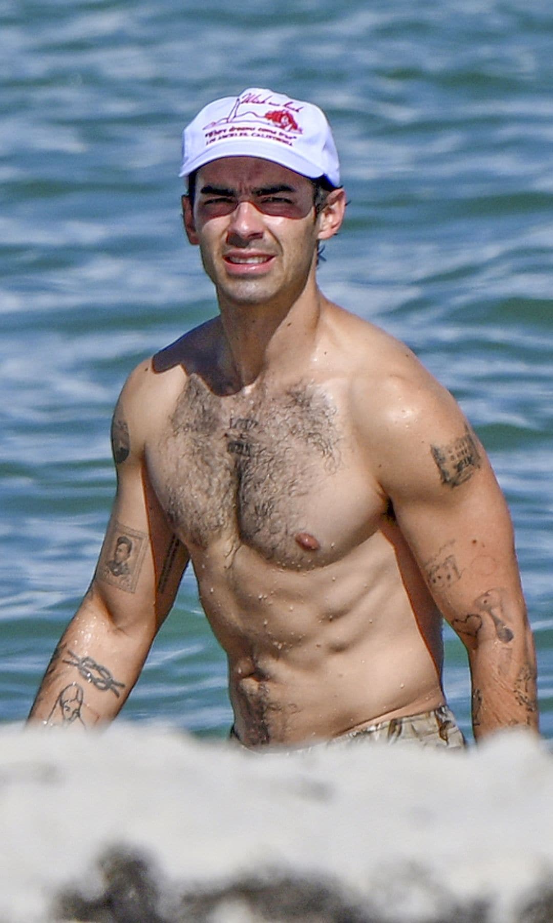 Joe Jonas shows off his six-pack on the beaches of Miami