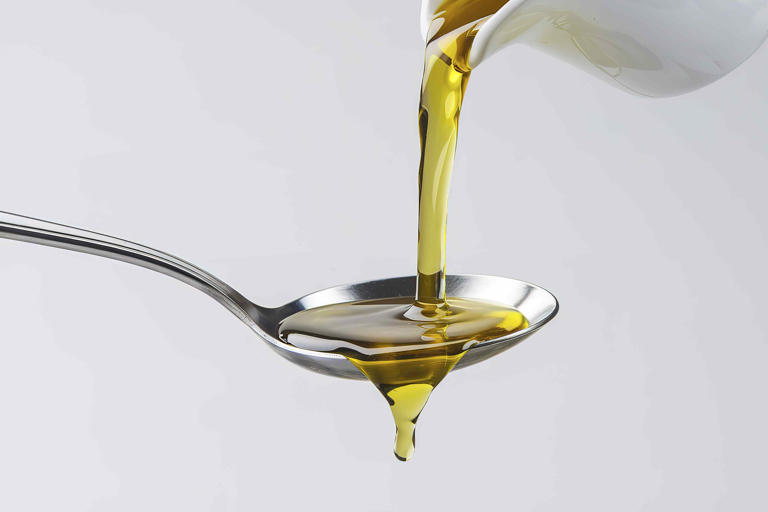 What happens to your digestion when you eat a spoonful of olive oil