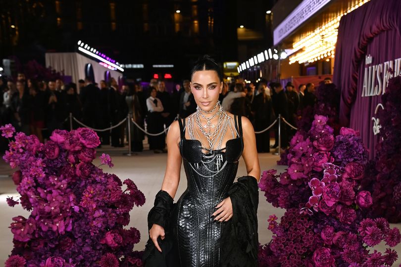 Kim Kardashian wows in leather and chains as she joins co-stars at All ...