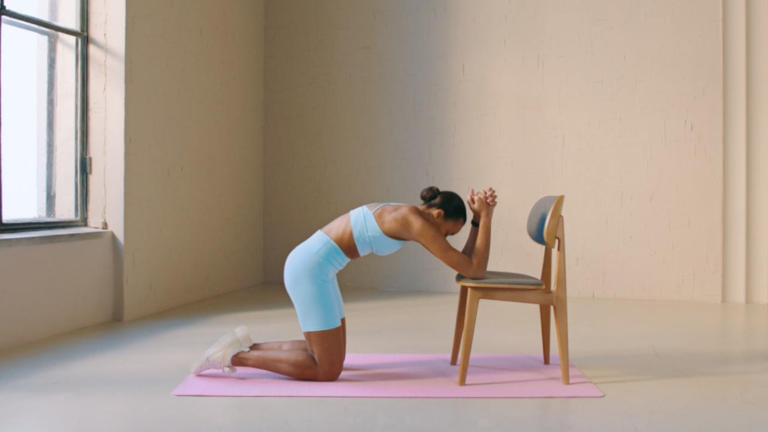 An expert shares three easy chair stretches to soothe back and shoulder ...