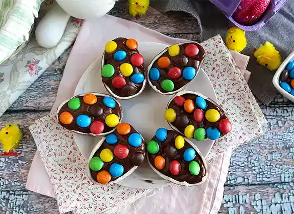 Chocolate easter eggs filled with chocolate custard and topped with m&m's