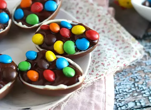 Chocolate easter eggs filled with chocolate custard and topped with m&m's