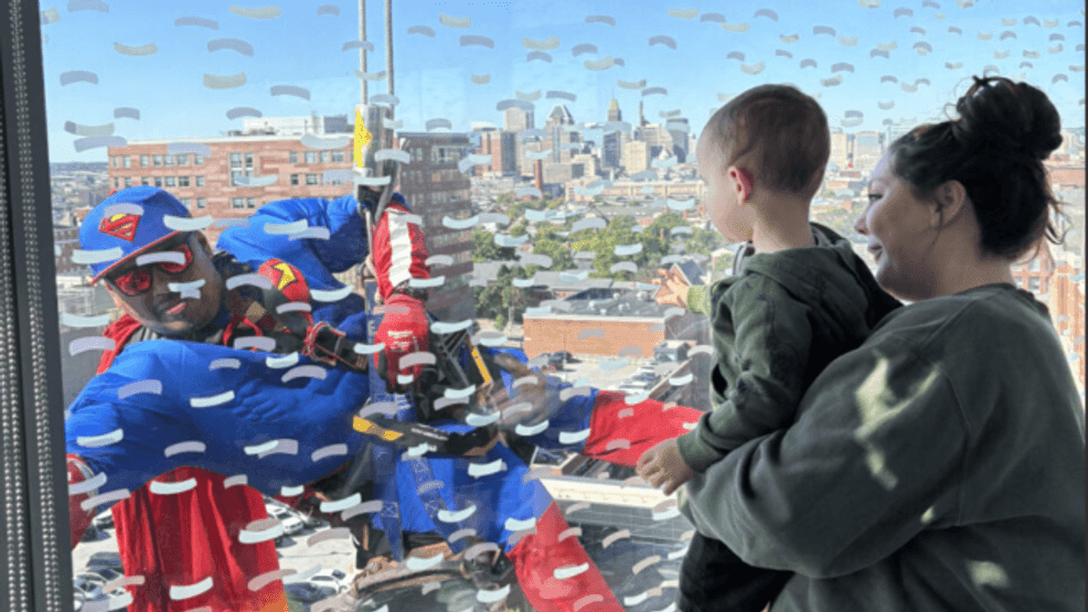 Superhero window washers visit patients at Johns Hopkins Children's Center