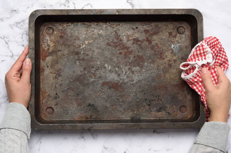 Oven tray grease will melt off 'like magic' if you soak in 1 unusual ...