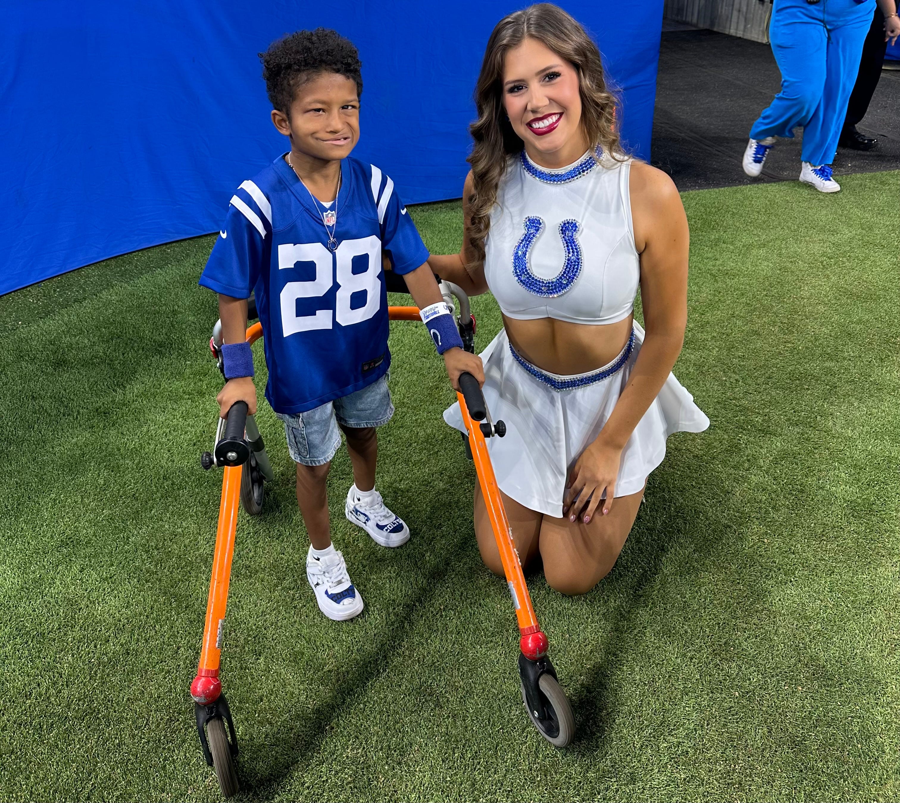 At first the stadium was silent. Then a Colts cheerleader used sign ...
