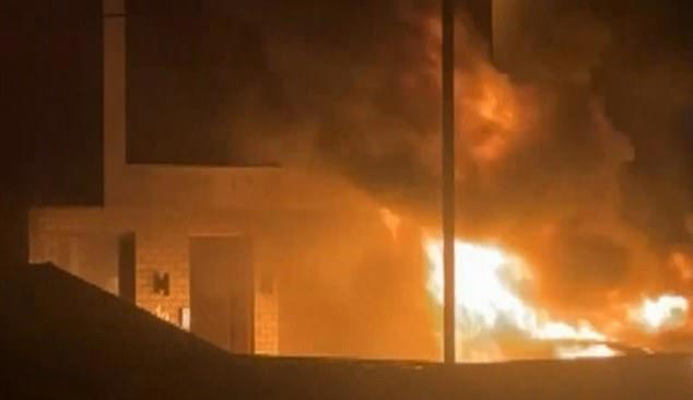 Massive fire destroys home after two cars suddenly burst into flames ...