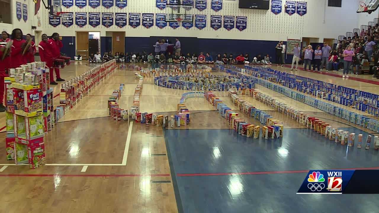 WATCH: 2,915 boxes of food create giant dominoes at Clemmons Middle School