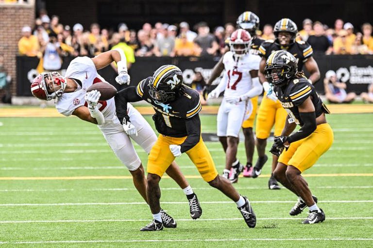Alabama star helped to locker room after being left motionless by ...