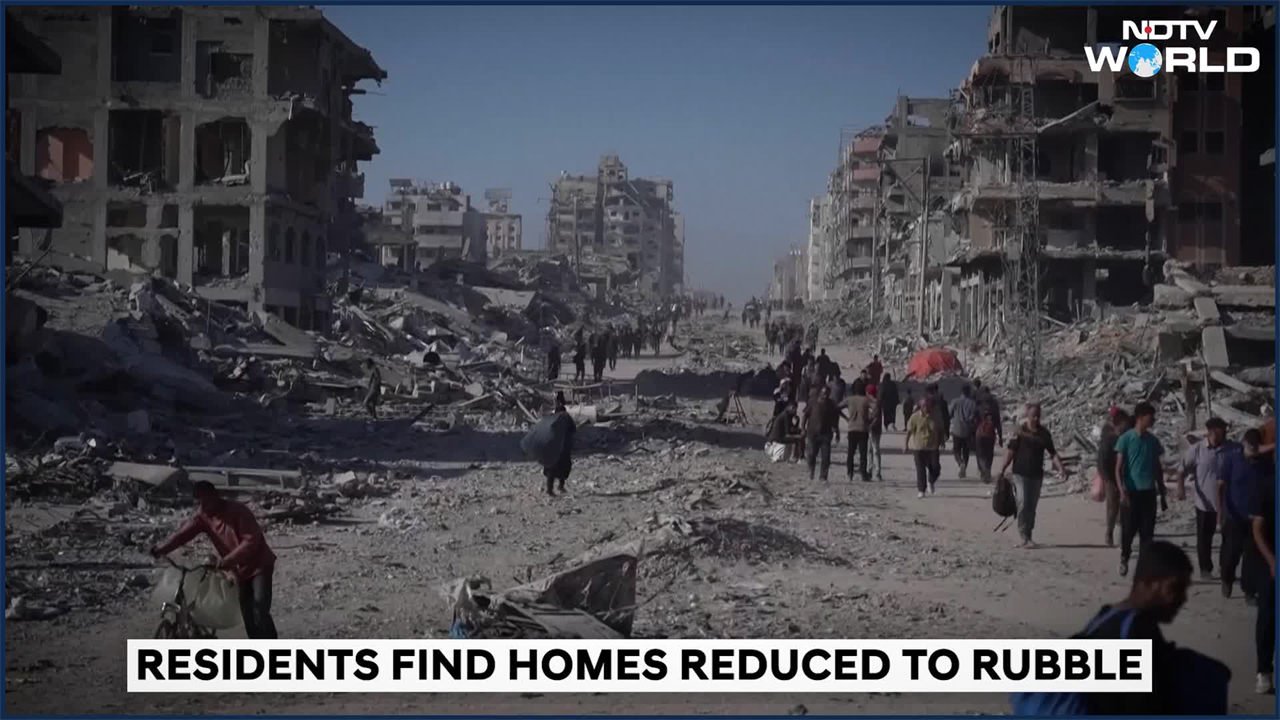 Displaced Palestinians Pass Scenes Of Devastation In Gaza City As They ...