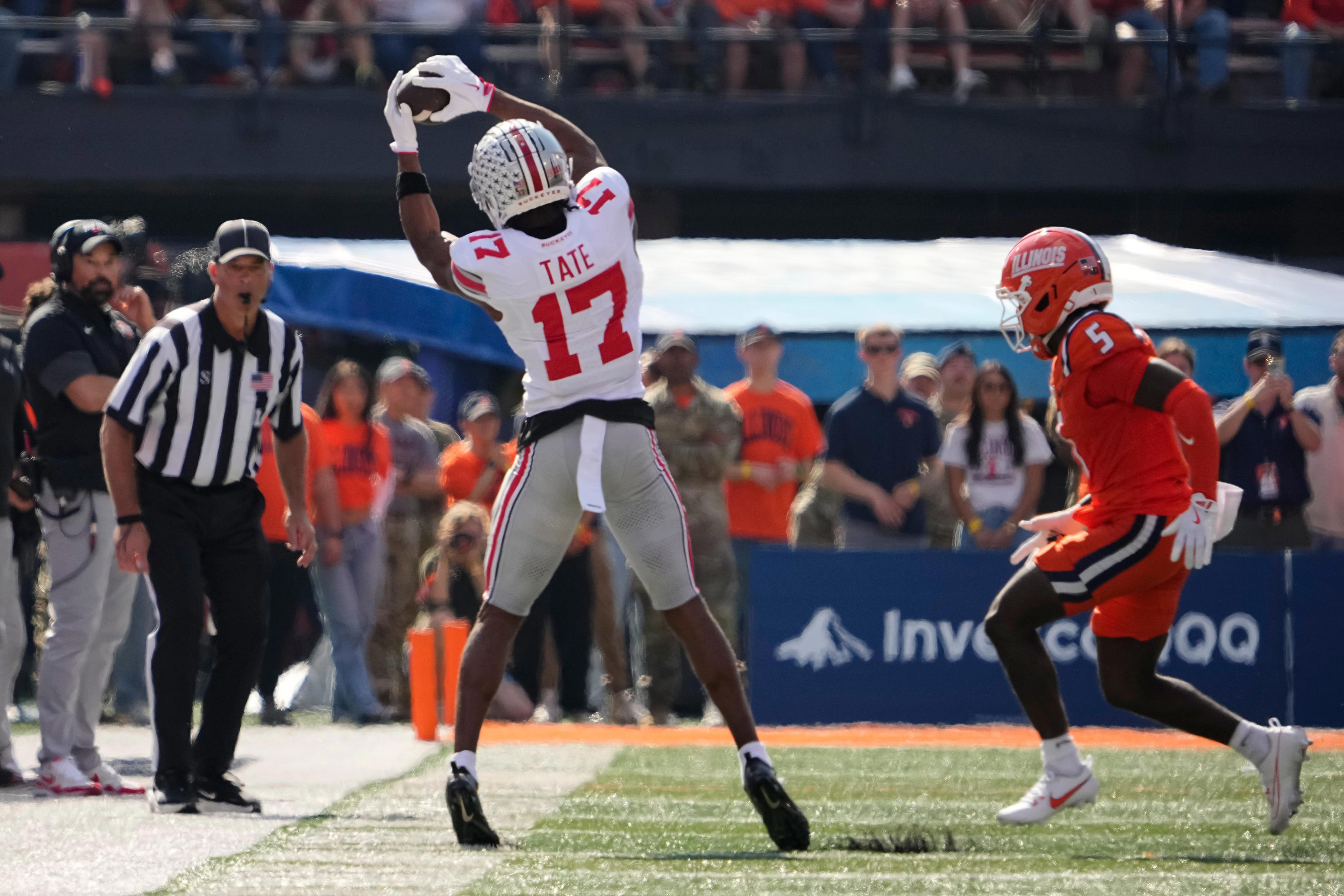 Watch Ohio State's Carnell Tate make a circus catch over two defenders ...