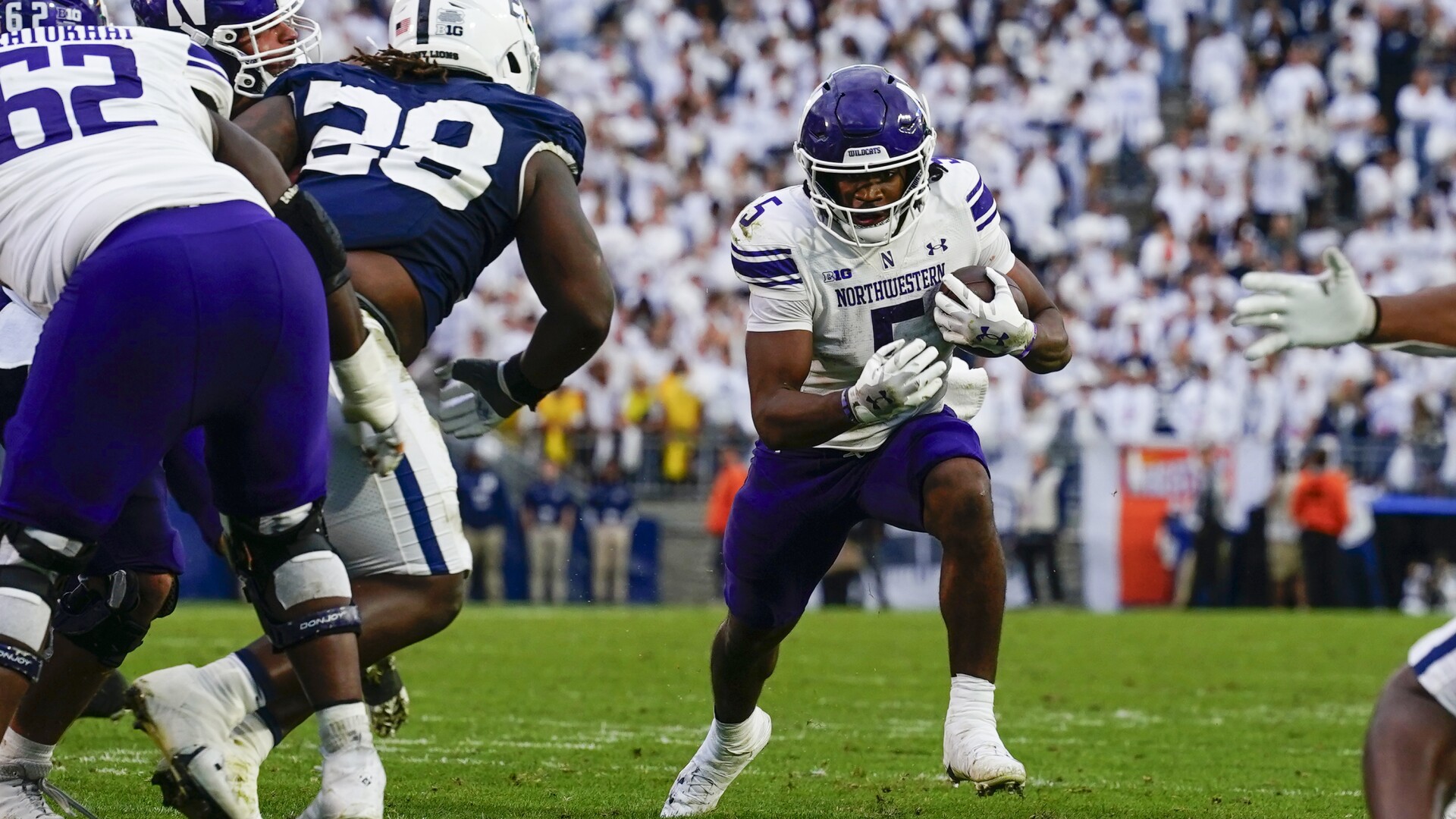 Komolafe scores late, leads Northwestern to 22-21 win over Penn State