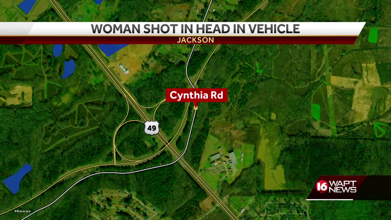 Woman shot in head while riding in SUV, child in back seat