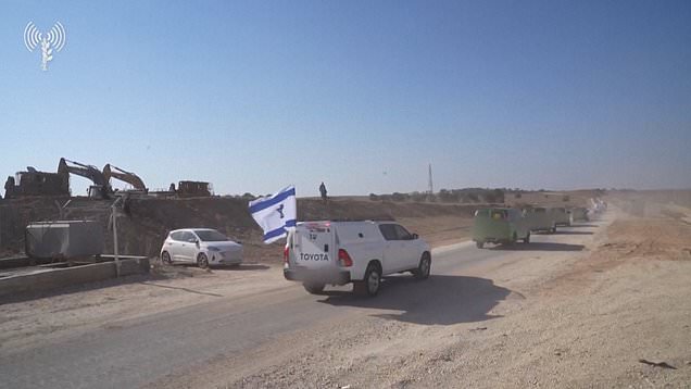 Convoy reportedly carrying Israeli hostages returns to Israel from Gaza