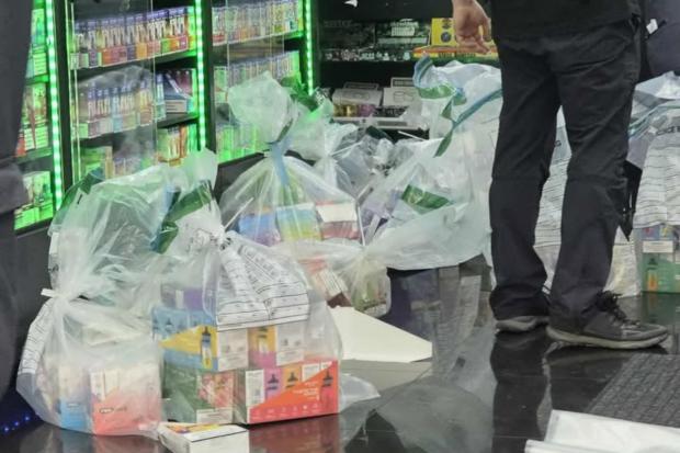Police raids targeting 'organised gangs' see arrests made and £25k seized