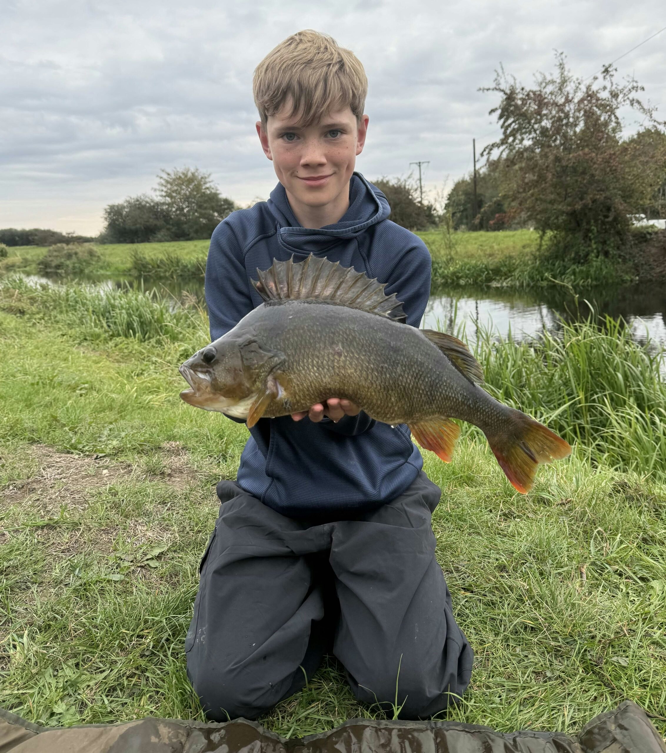 Schoolboy lands huge perch from small stream
